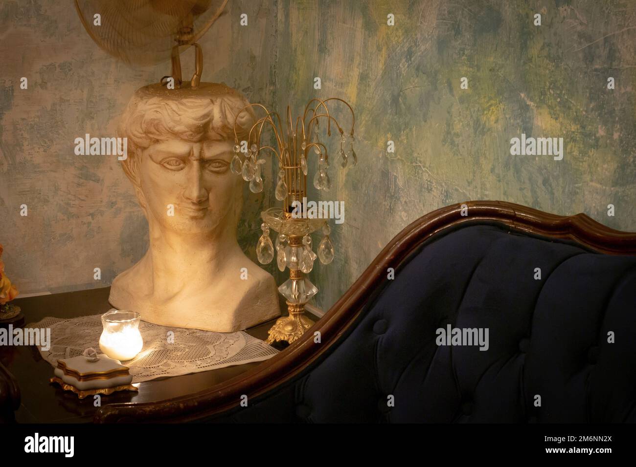 An interior of room with statue head Stock Photo - Alamy