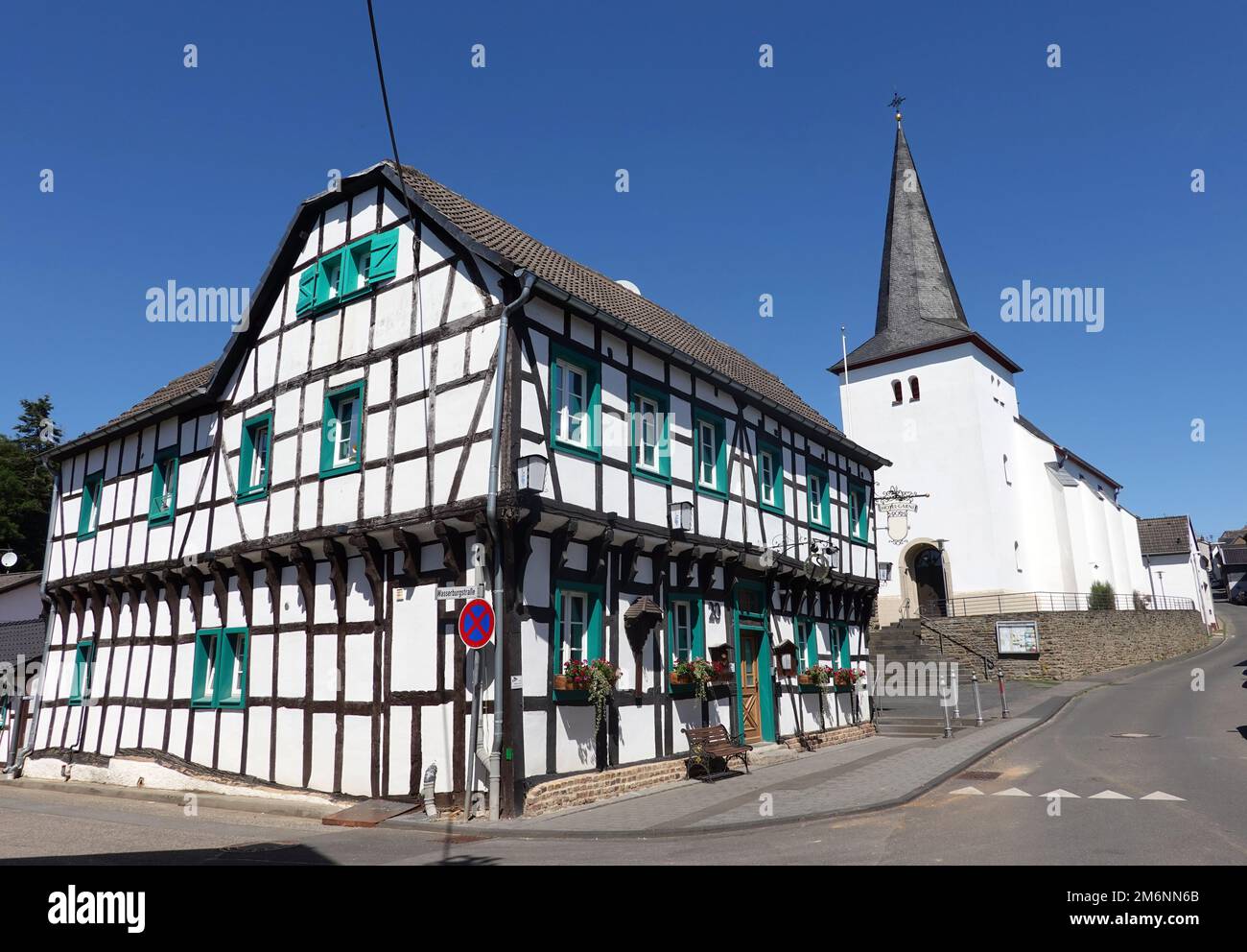 Half-timbered house and Catholic parish church of St. John Metternich ...