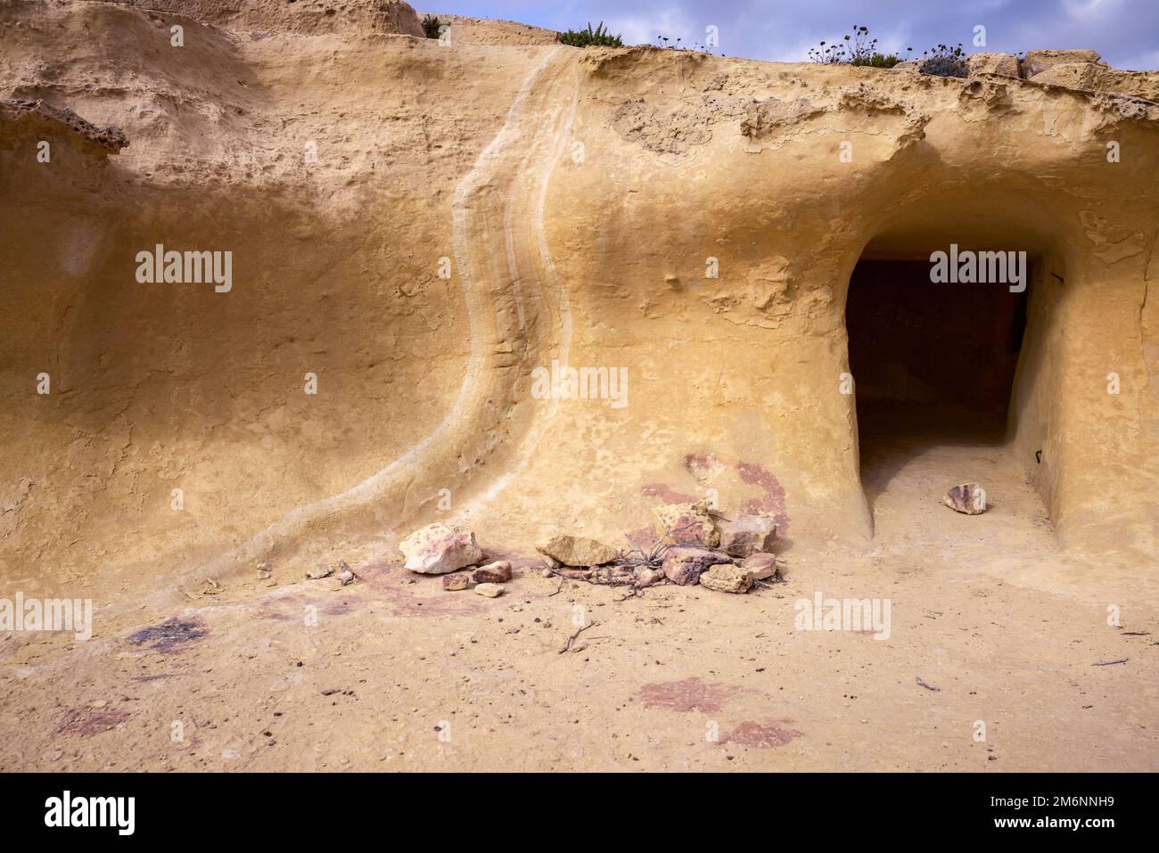 cave in the ground by the sea in Malta Stock Photo - Alamy