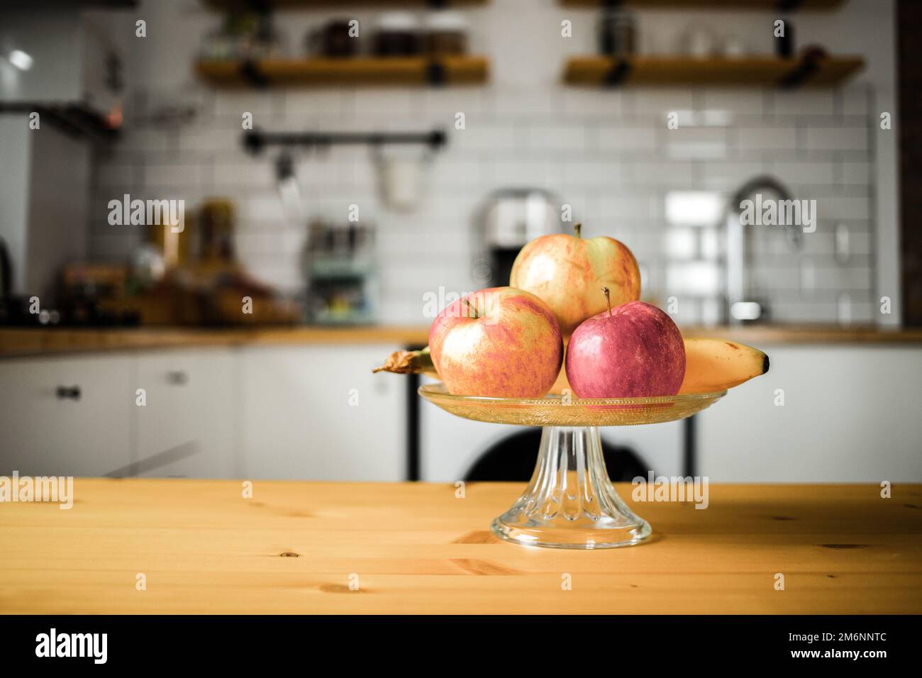 Fresh fruit apples and bananas in modern kitchen Stock Photo - Alamy