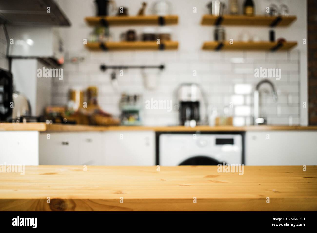 Empty wooden tabletop and blurred kitchen mock up for product display ...