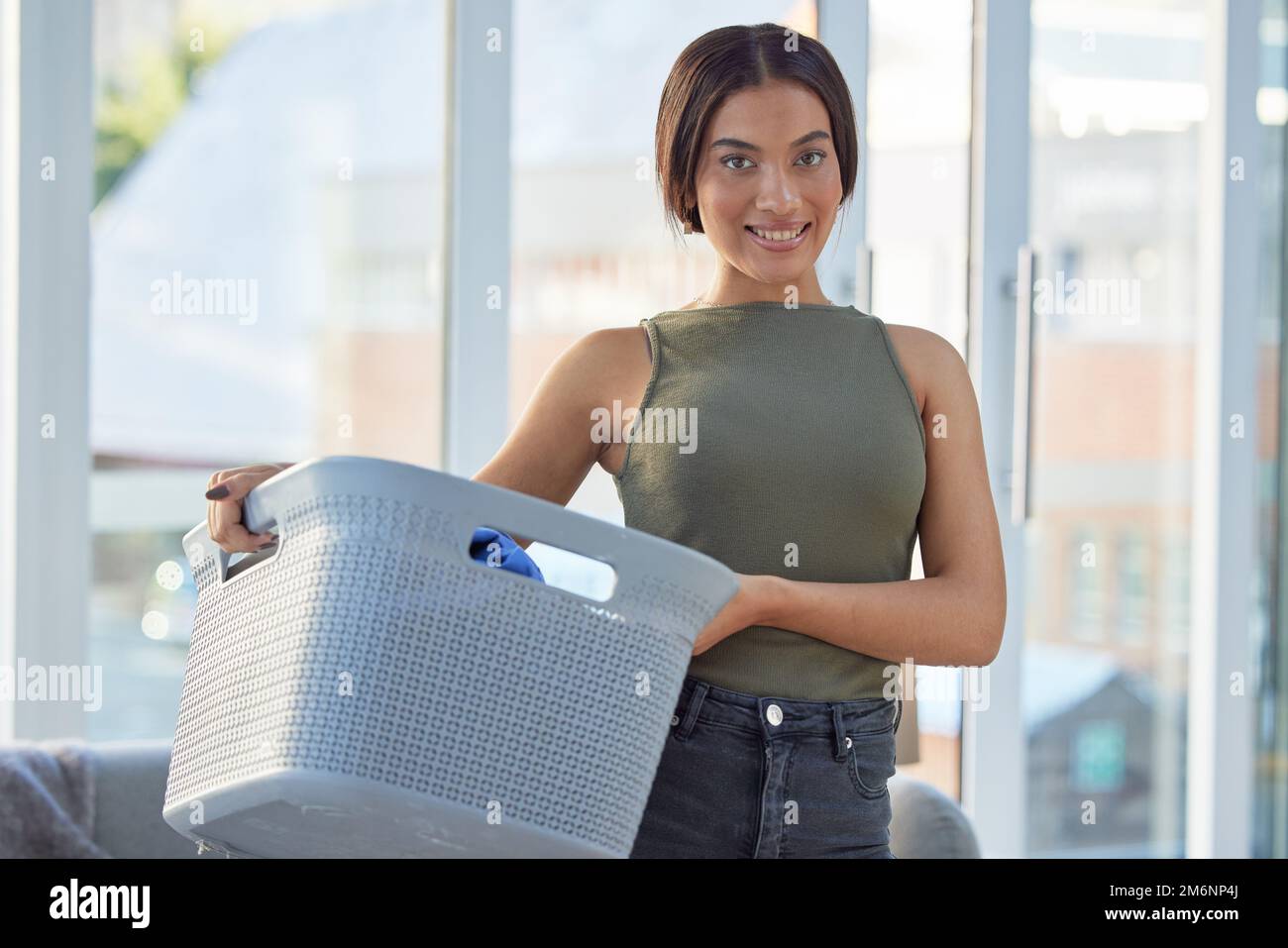 Laundry, basket and portrait of black woman with clean fabric clothes ...