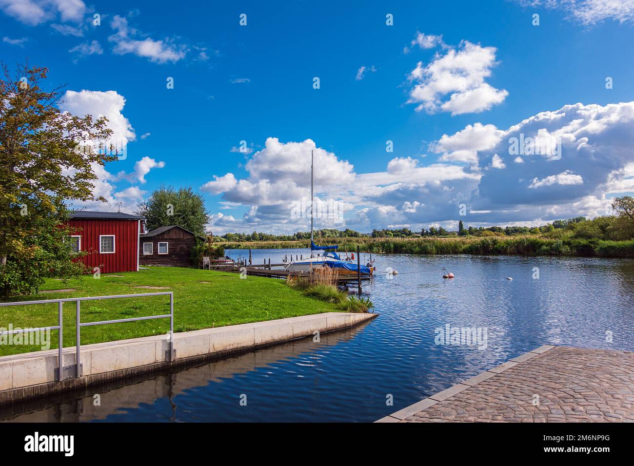 Canal And Boathouse On The Warnow River In The Hanseatic City Of ...