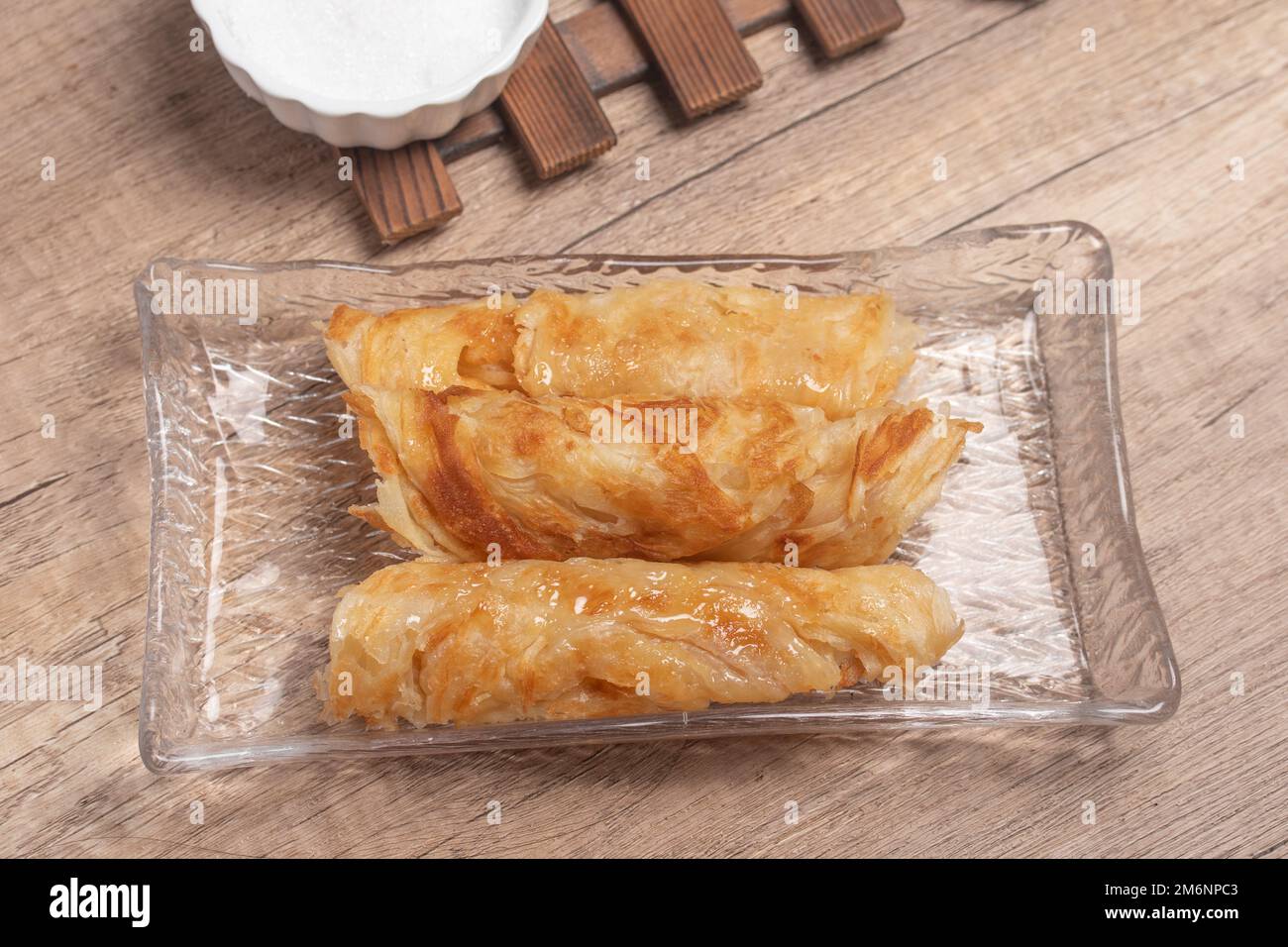 Fried Roti with Sweetened Condensed Milk Thai Dessert Stock Photo - Alamy