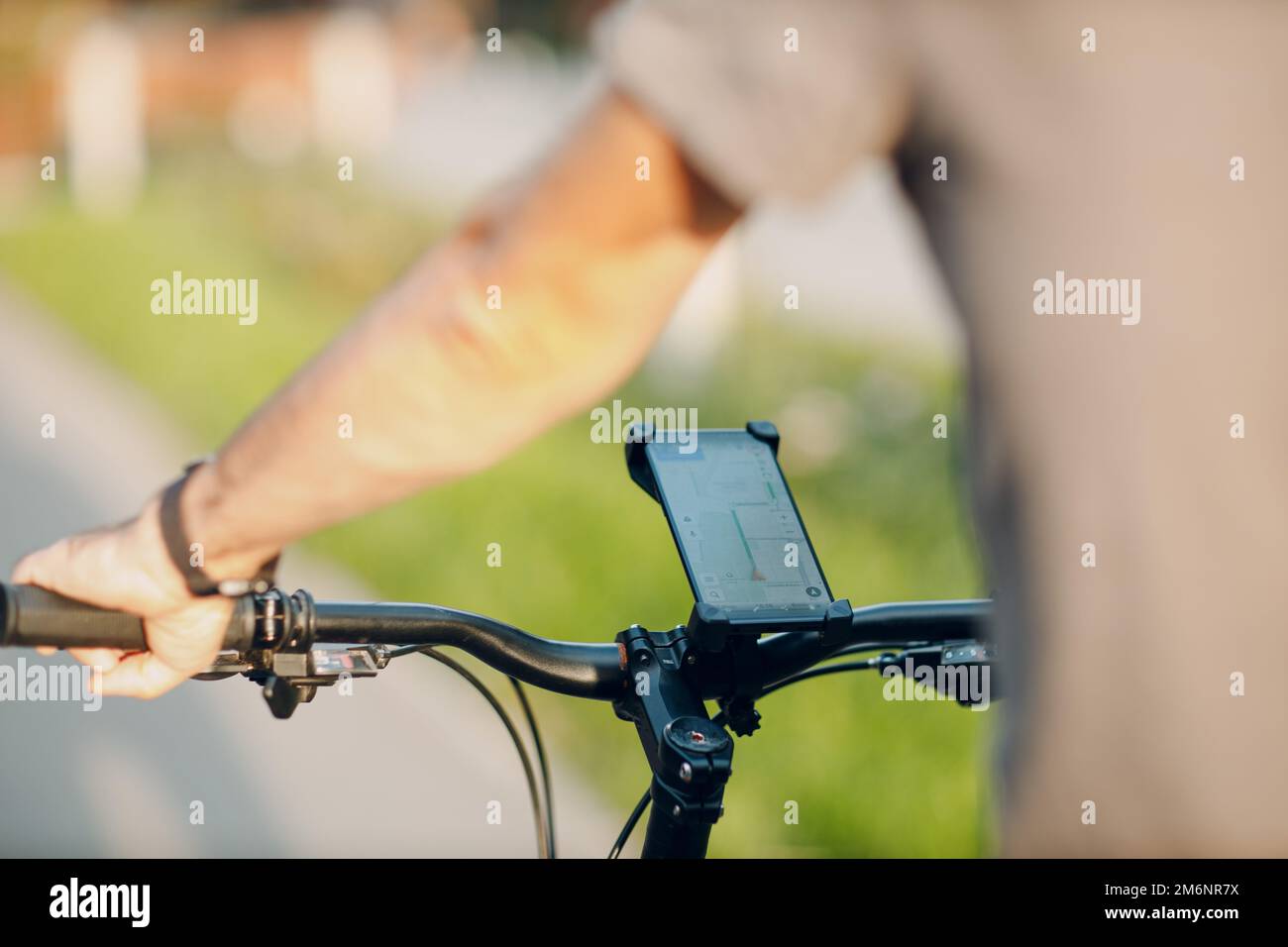 Man planning route using GPS navigation application in mobile phone on ... Man planning route using GPS navigation application in mobile phone on ...