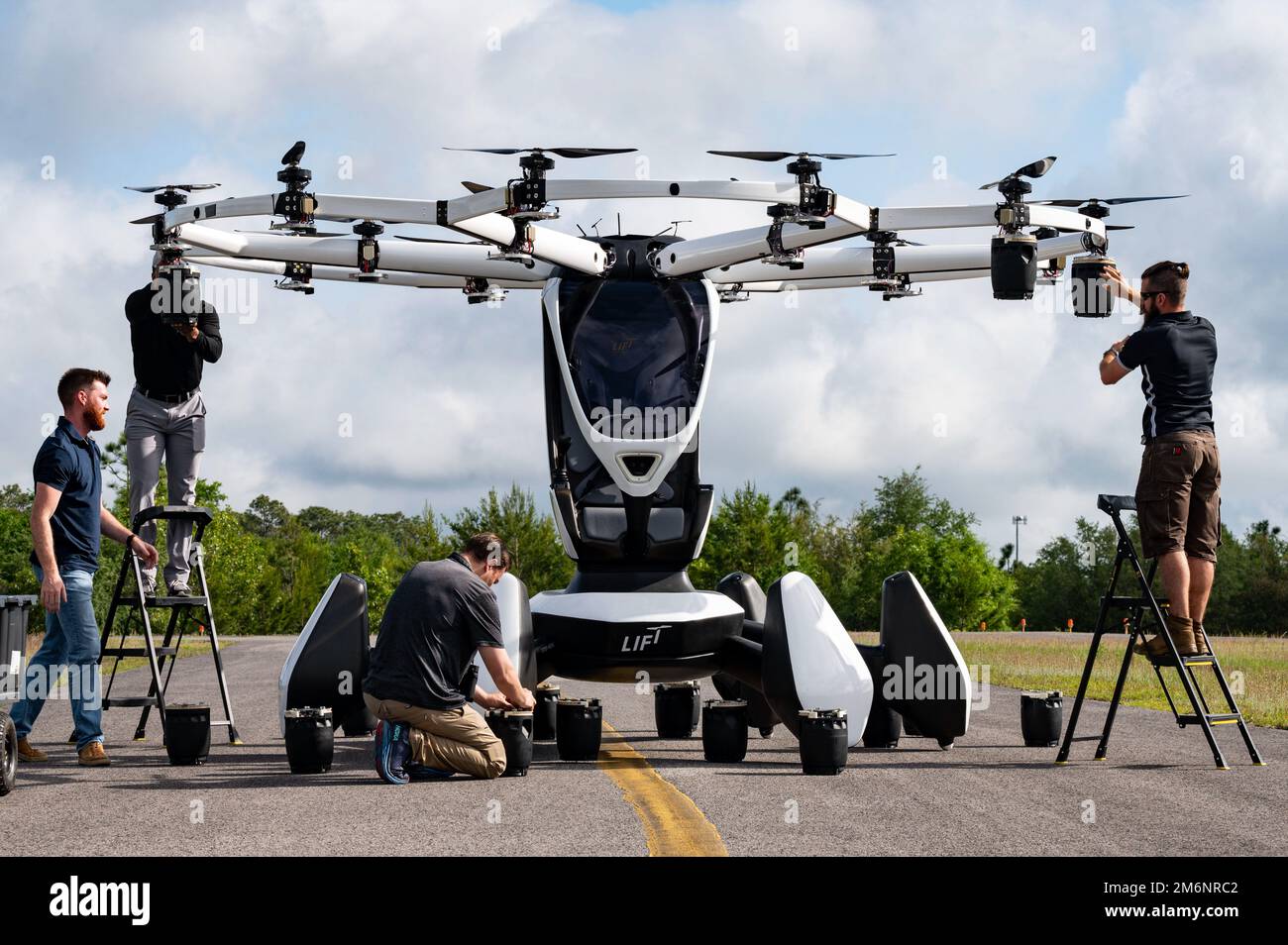 Members of Lift Aircraft prepare Lift Aircraft’s Hexa aircraft for a ...