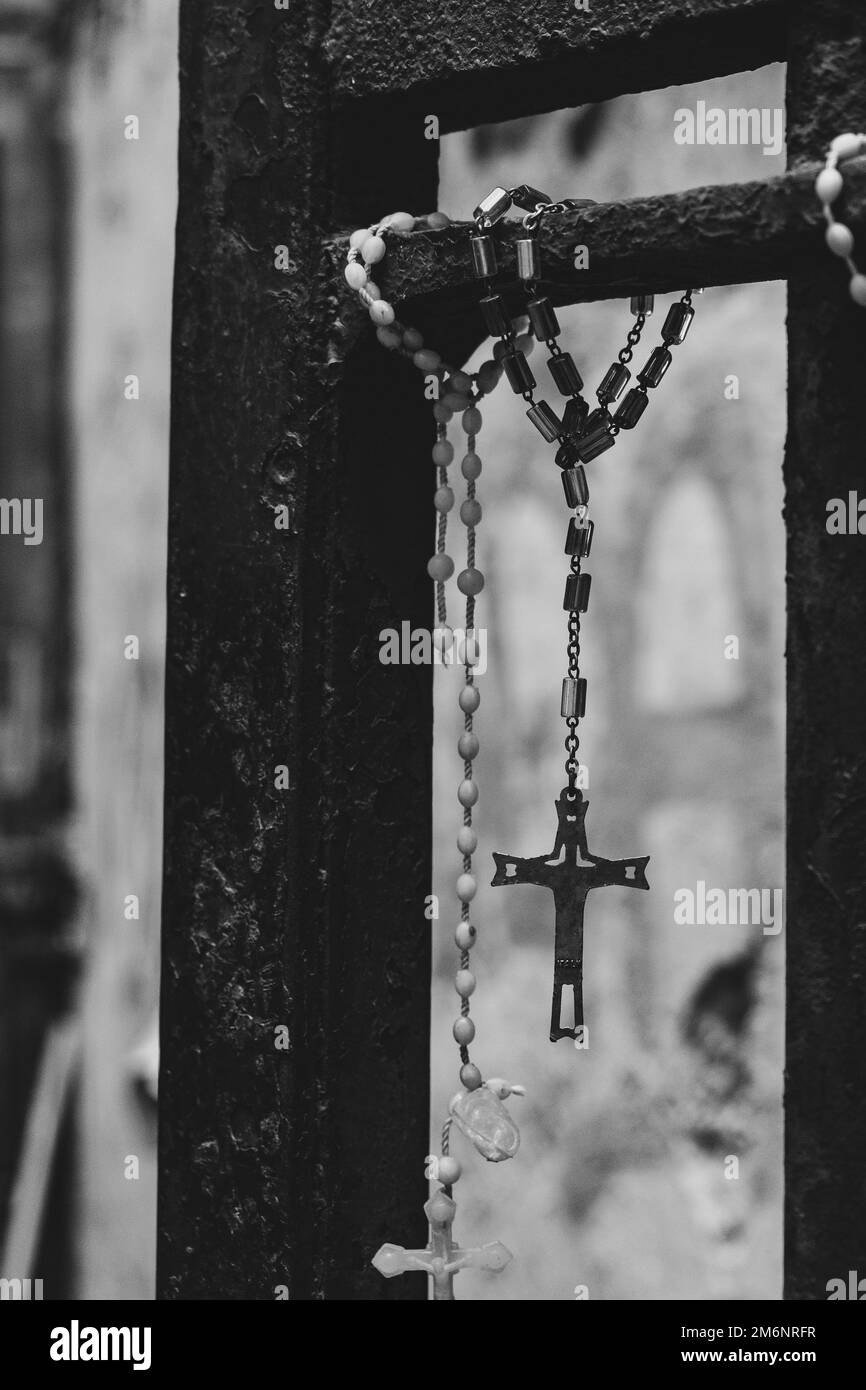 A vertical grayscale shot of a cross Stock Photo - Alamy
