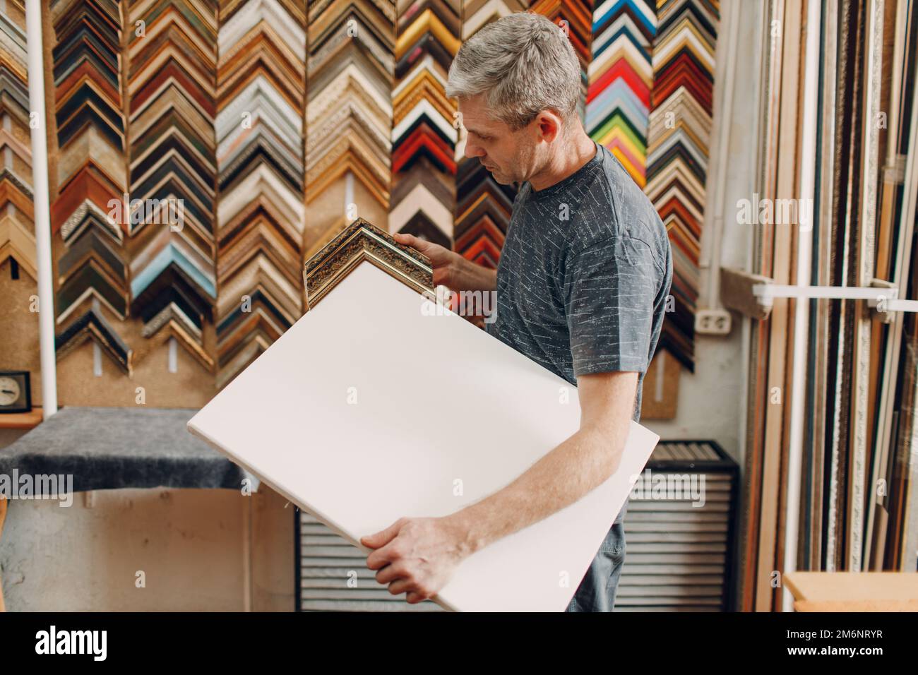 Framing Workshop. Making baguette handmade picture frame at studio Stock Photo - Alamy