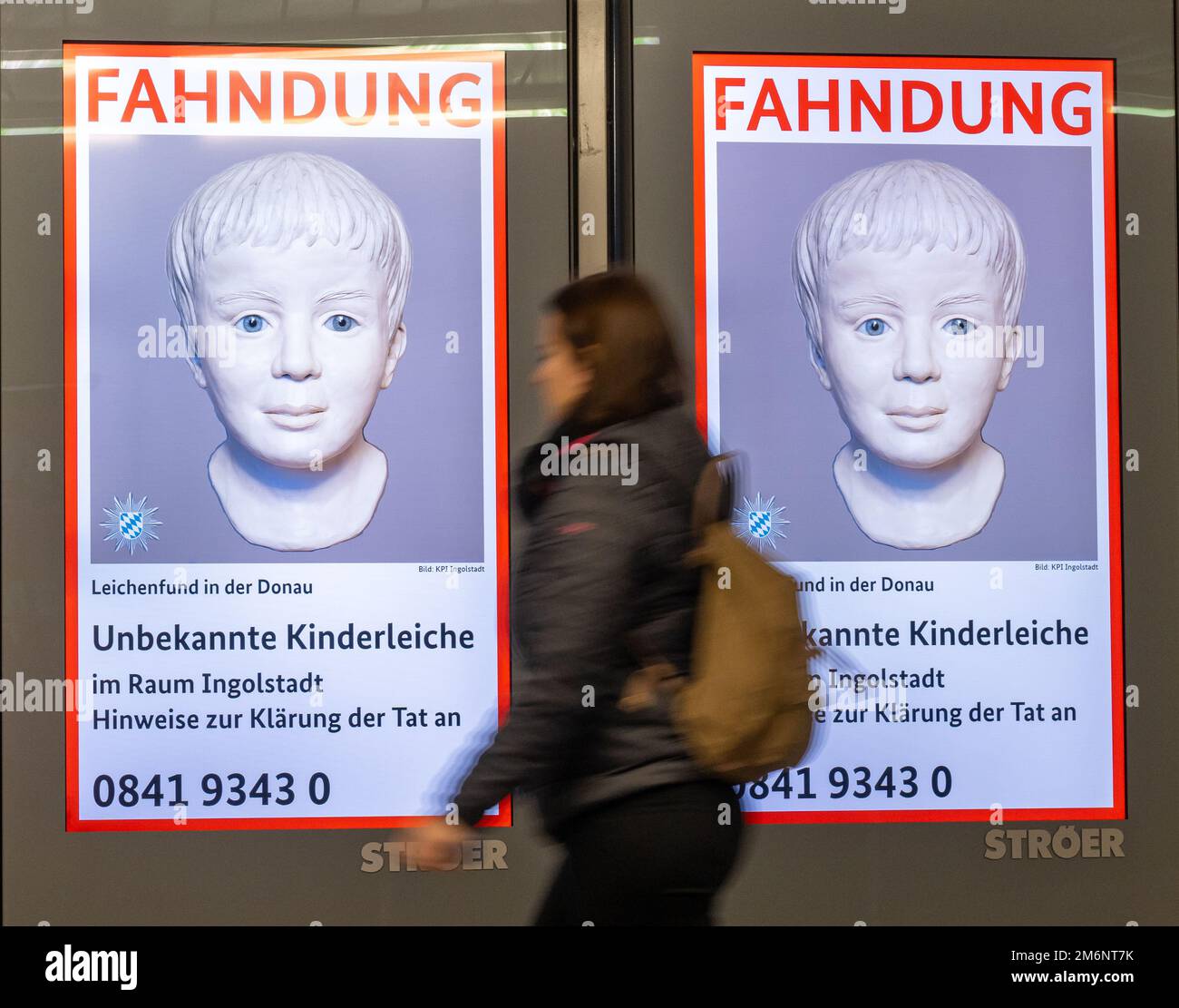 Munich, Germany. 05th Jan, 2023. A woman walks past a digital wanted ...