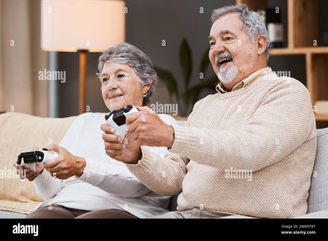 Video game, sofa and senior couple with gaming online in home for happy ...