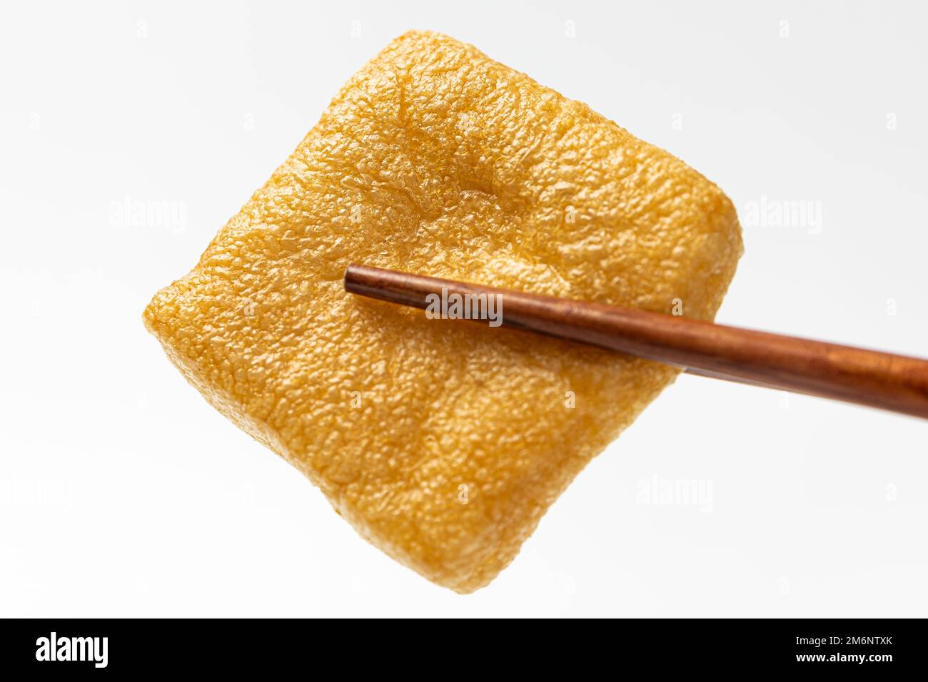 square fried tofu on a white background Stock Photo - Alamy