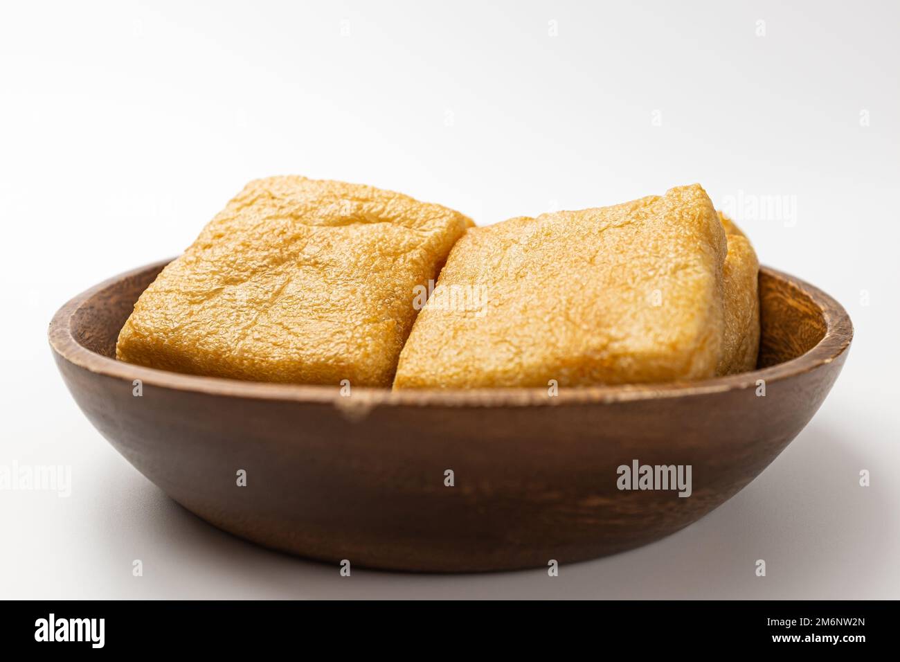 square fried tofu on a white background Stock Photo - Alamy