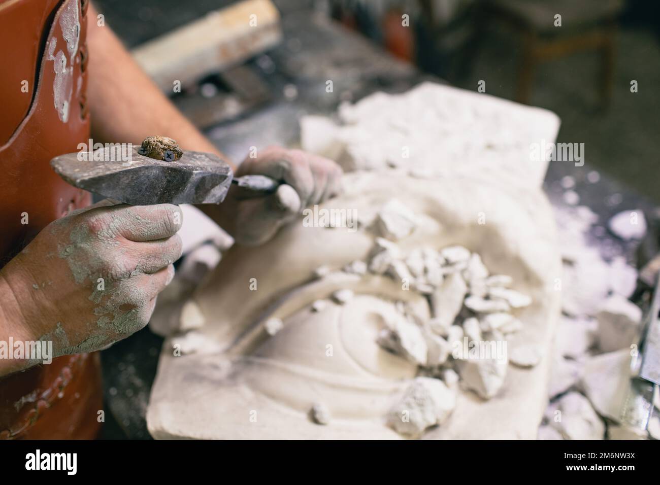 Man sculptor creates sculpt bust gypsum human woman sculpture. Statue ...