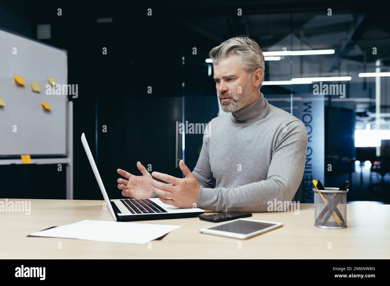 Dissatisfied gray haired boss in office, senior man disappointed with ...