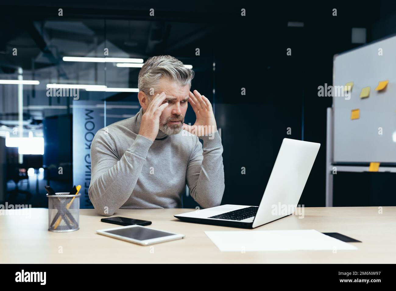 Senior thinking businessman working inside office with laptops, man ...