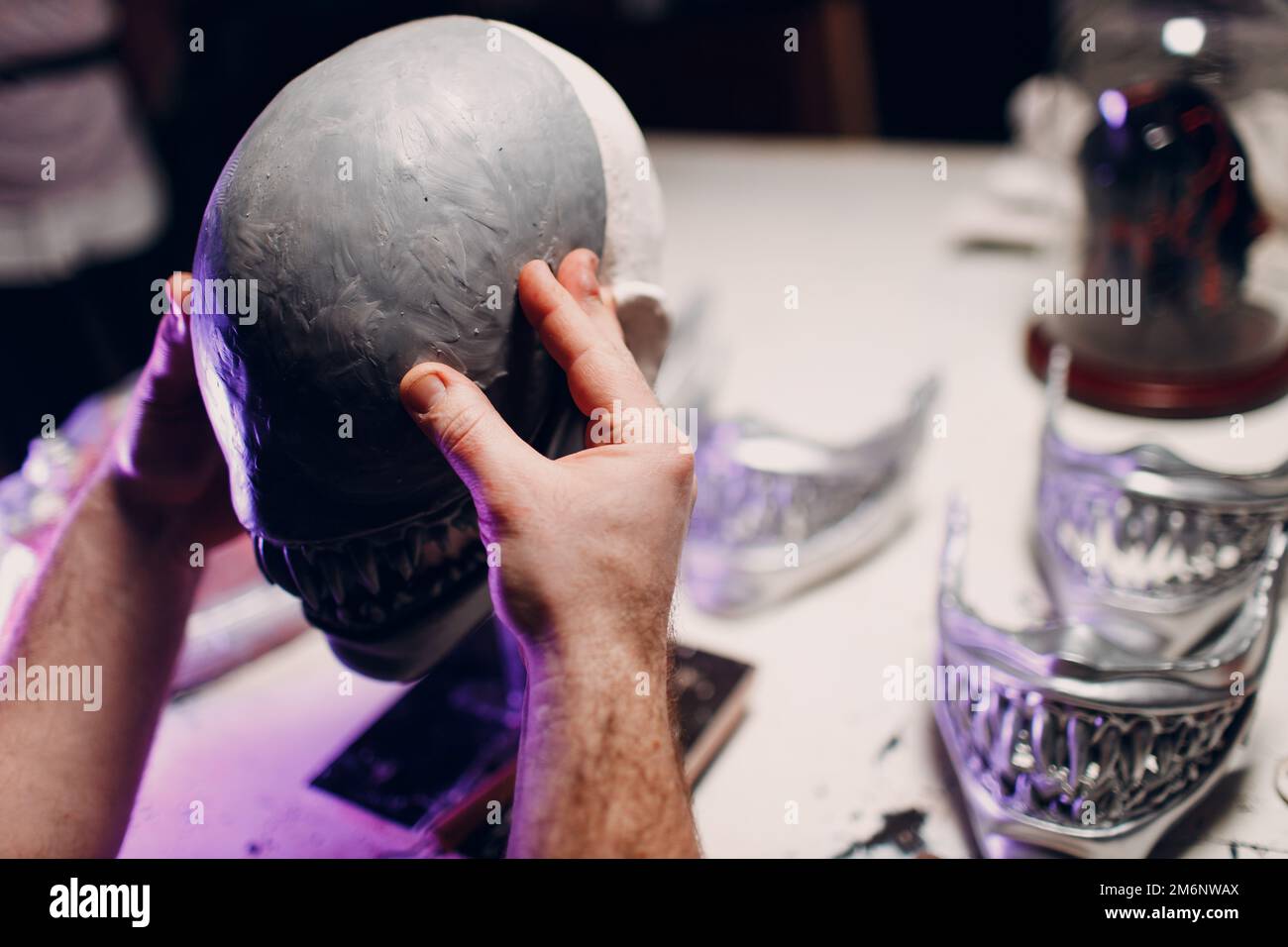 Artisan craftsman create mask based on plaster cast. Gypsum mold and ...