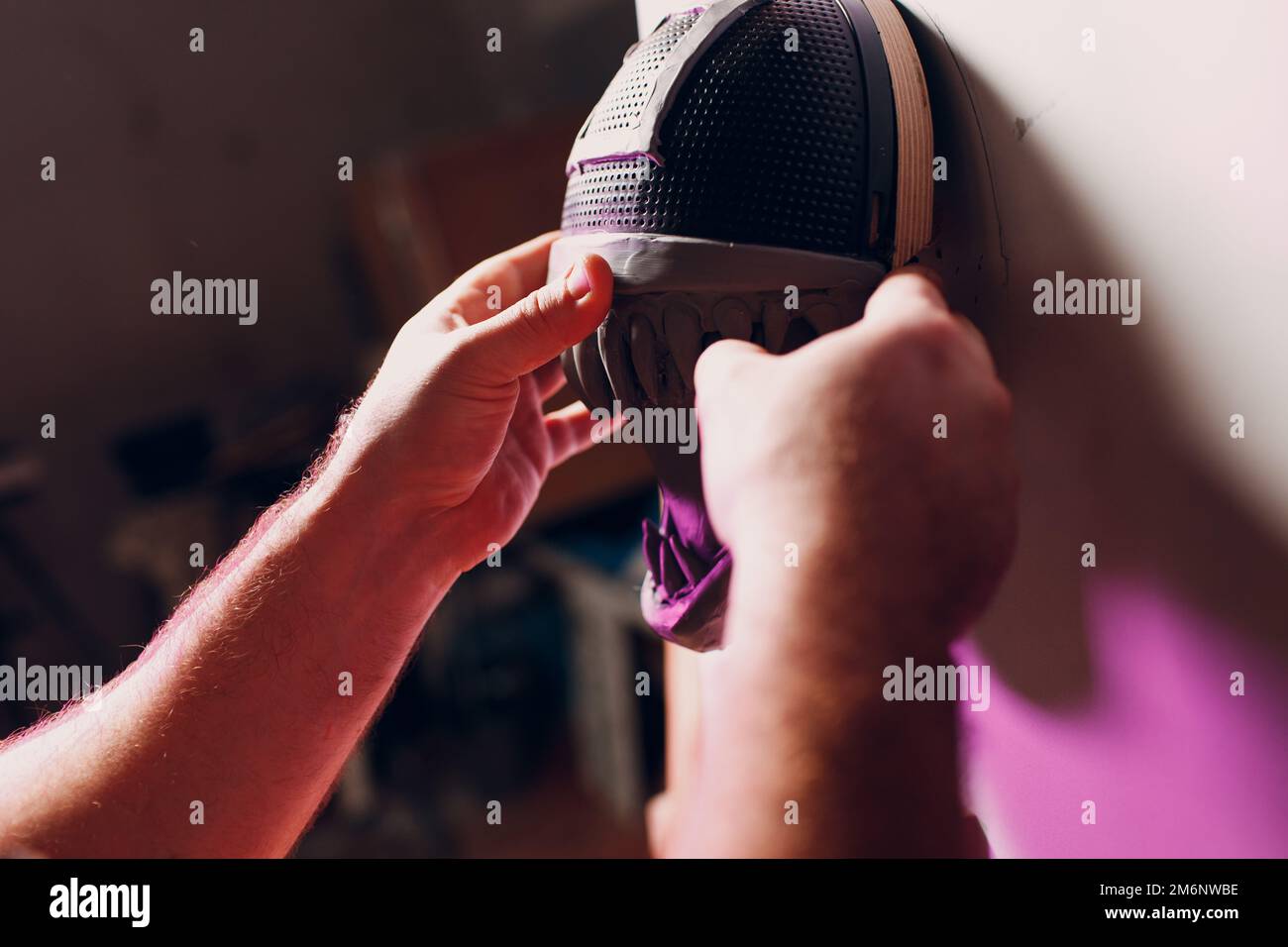 Artisan craftsman create mask based on plaster cast. Gypsum mold and ...
