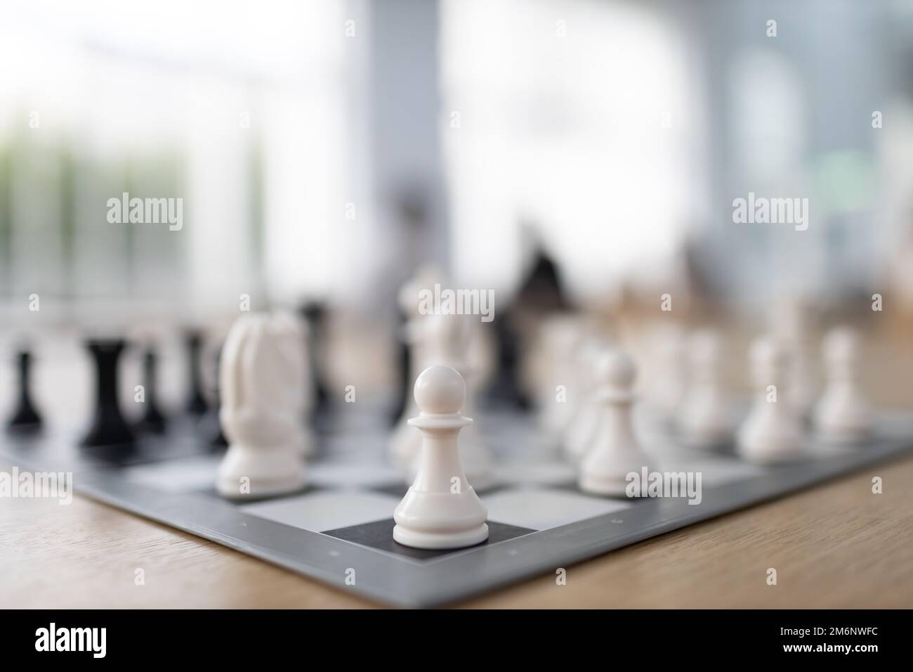 New chess board with chess pieces on table for game Stock Photo - Alamy