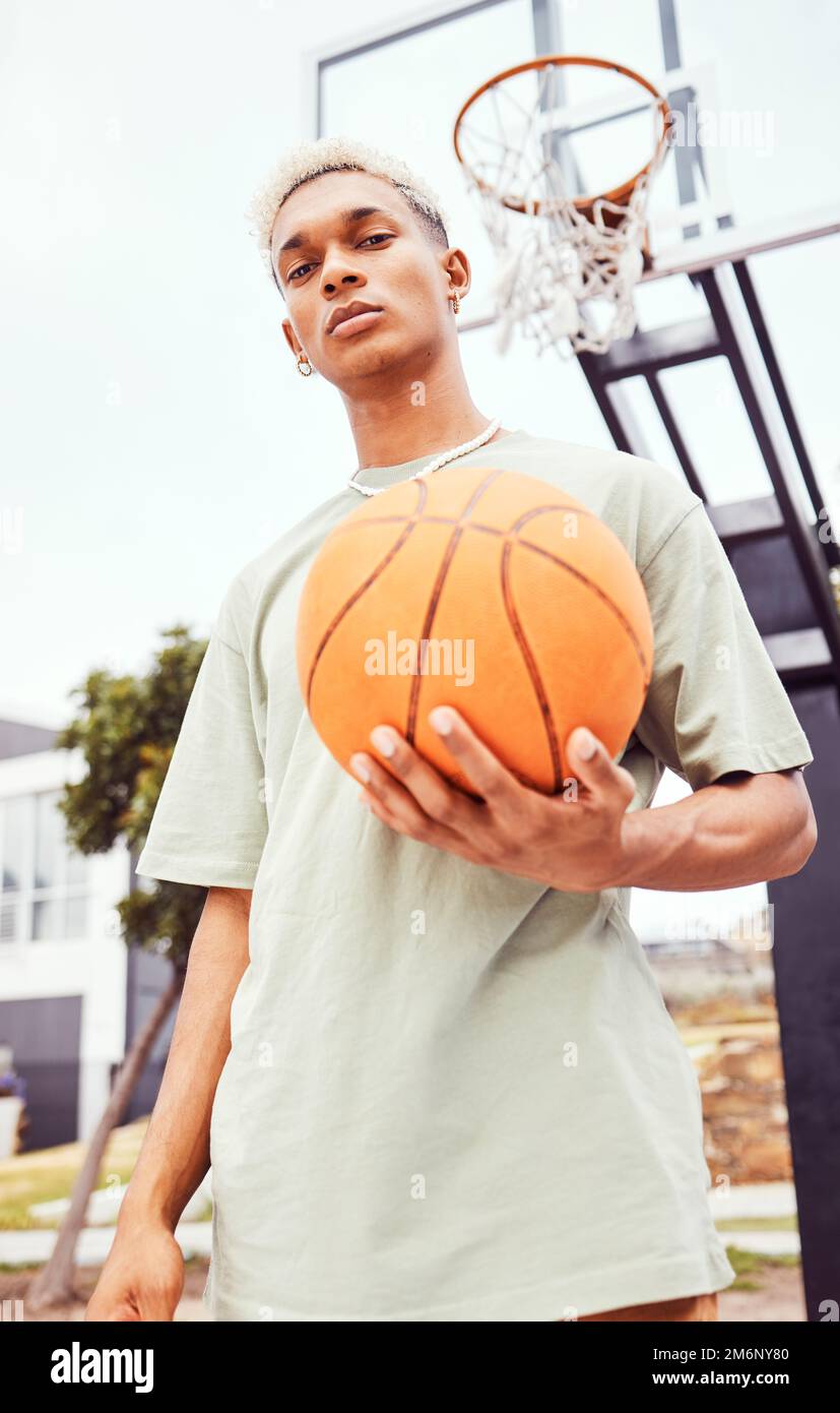Sports, basketball court and a portrait of man with ball outside at ...