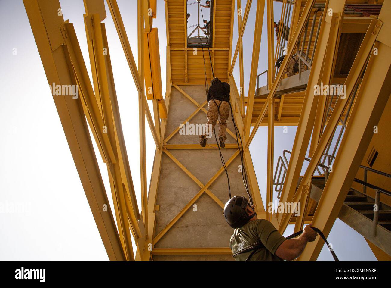 An educator from the 8th Marine Corps District, descends the rappel ...