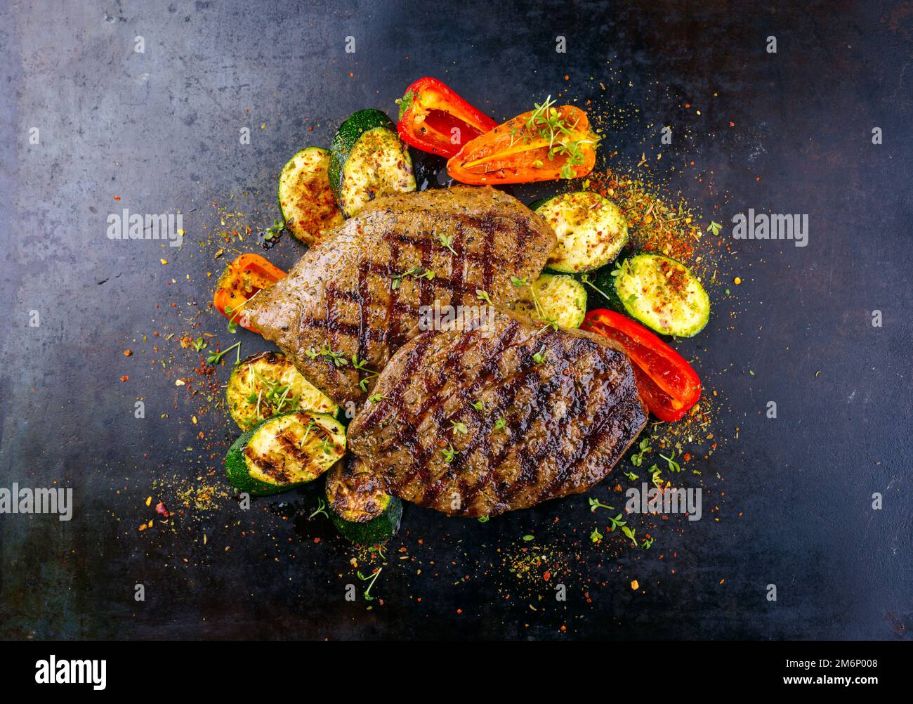 Traditional barbecue marinated pepper rump steak with grilled vegetable ...