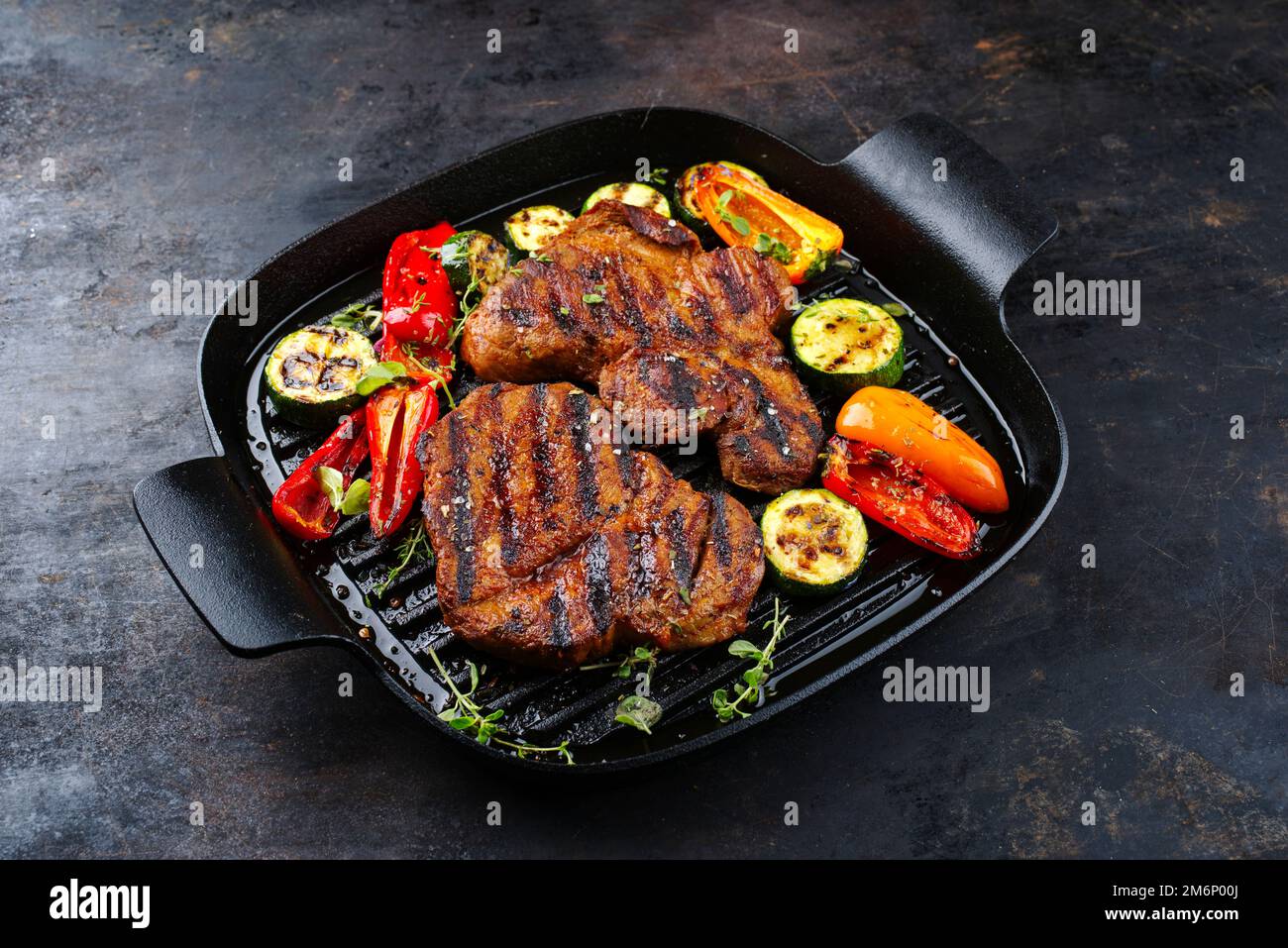 Traditional barbecue pork neck steak with grilled vegetable served and ...
