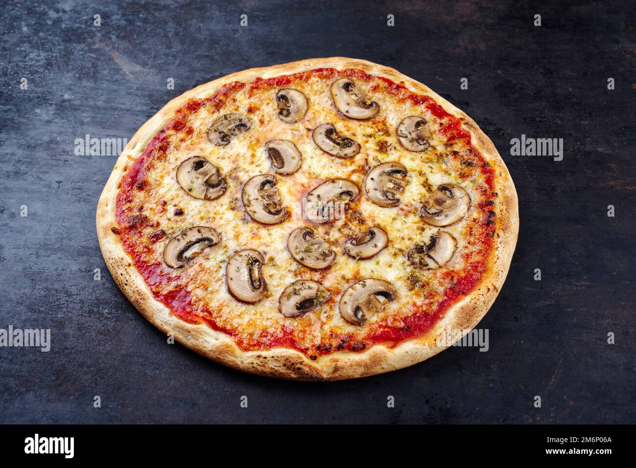 Traditional Italian pizza funghi with mushrooms and mozzarella served ...