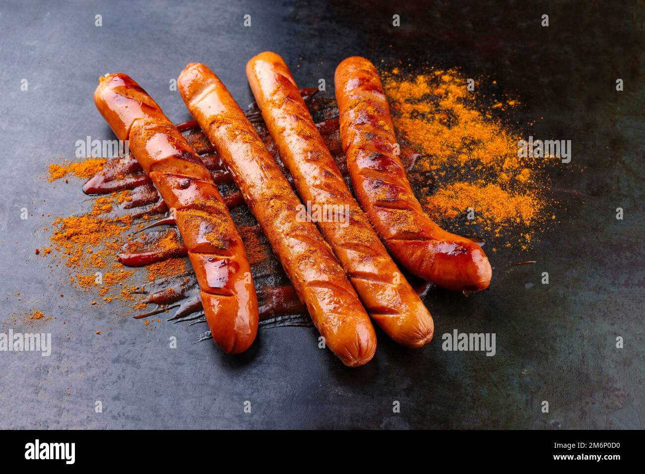 Traditional German barbecue curry wurst sausages with ketchup and curry ...