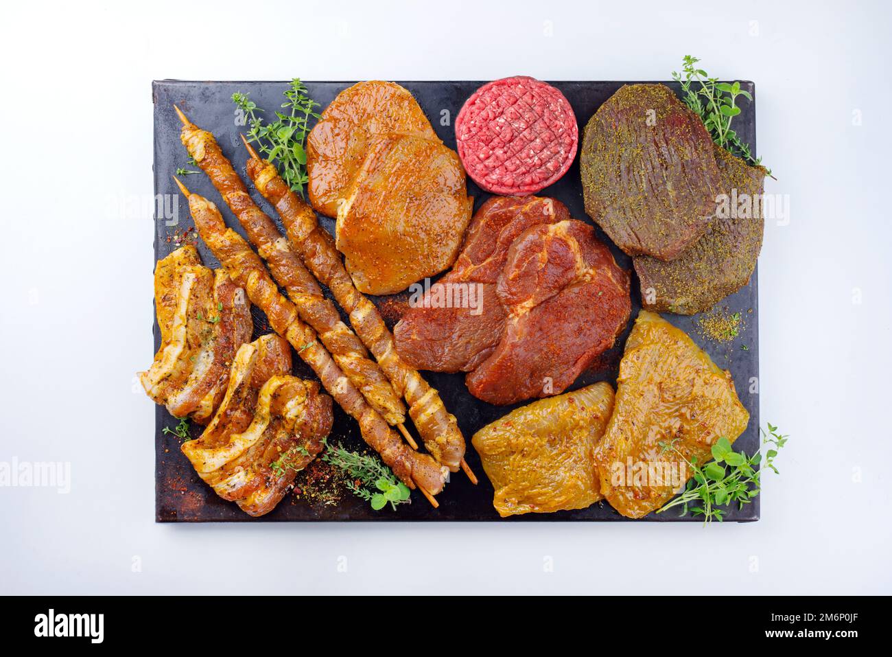 Traditional raw grill platter with hamburger Stock Photo - Alamy