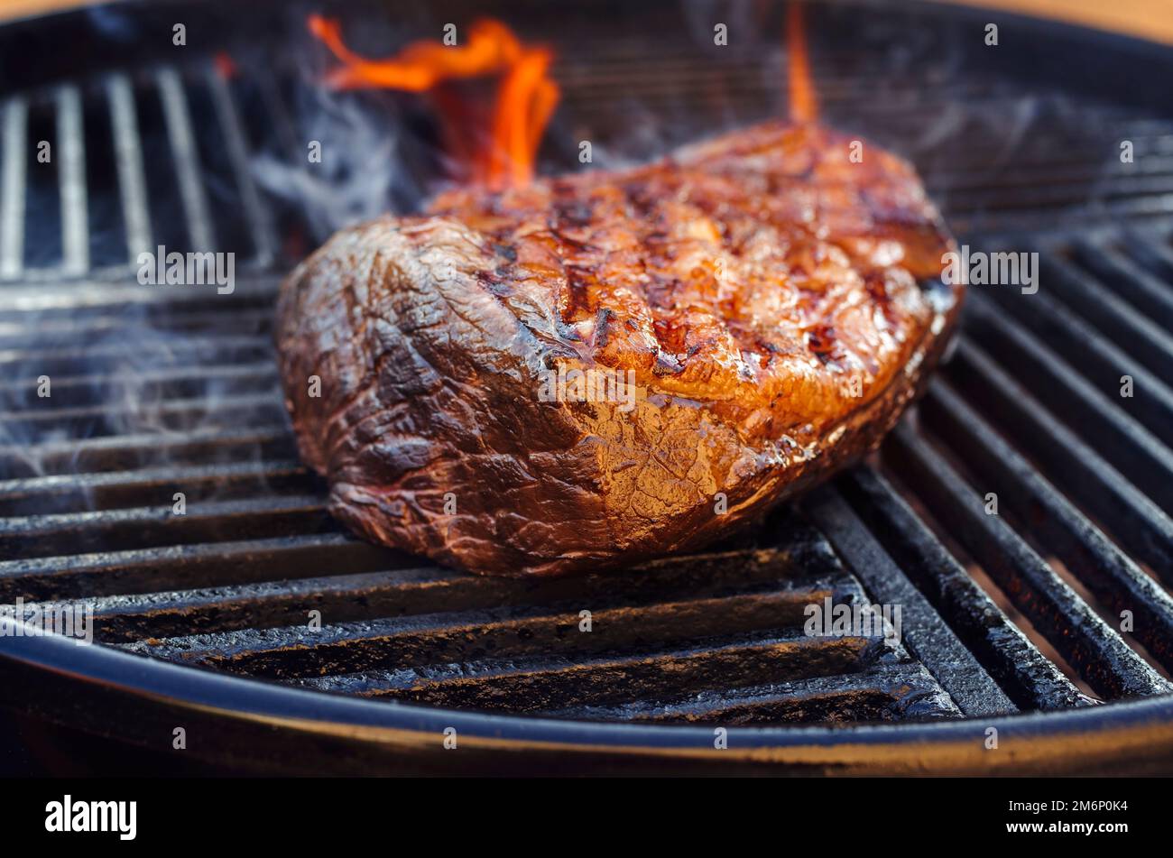 BBQ dry aged wagyu sirloin cap of rump beef steak grilled as close-up ...