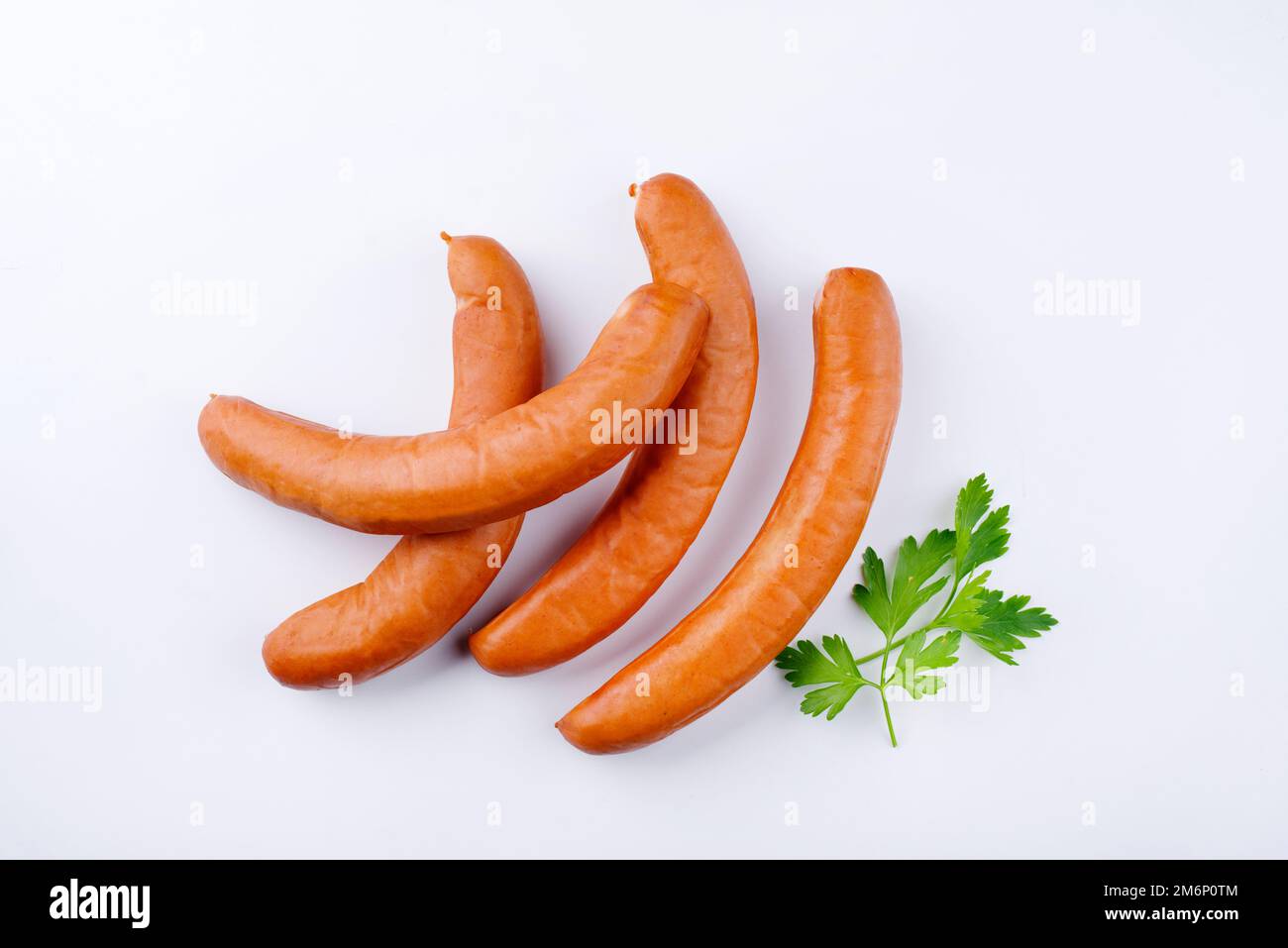 Traditional raw German bockwurst offered as top view on white ...
