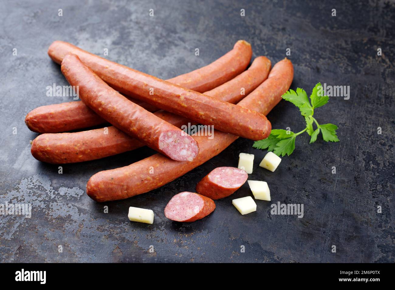 Traditional raw Austrian fine cheese sausage with cheese offered as ...