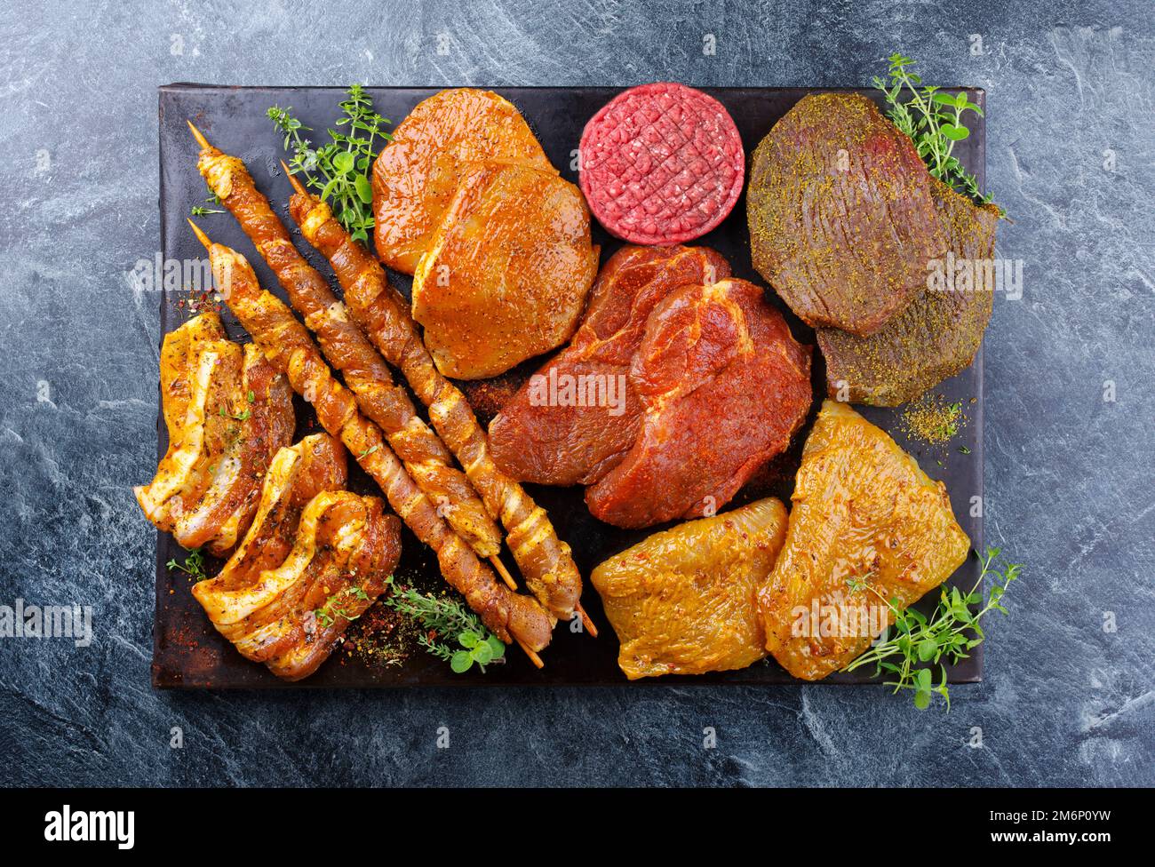 Traditional raw grill platter with hamburger Stock Photo - Alamy