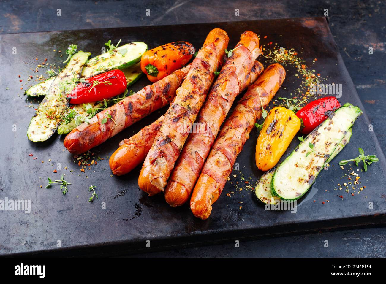 Traditional barbecue Bernese sausage with grilled vegetables served on ...