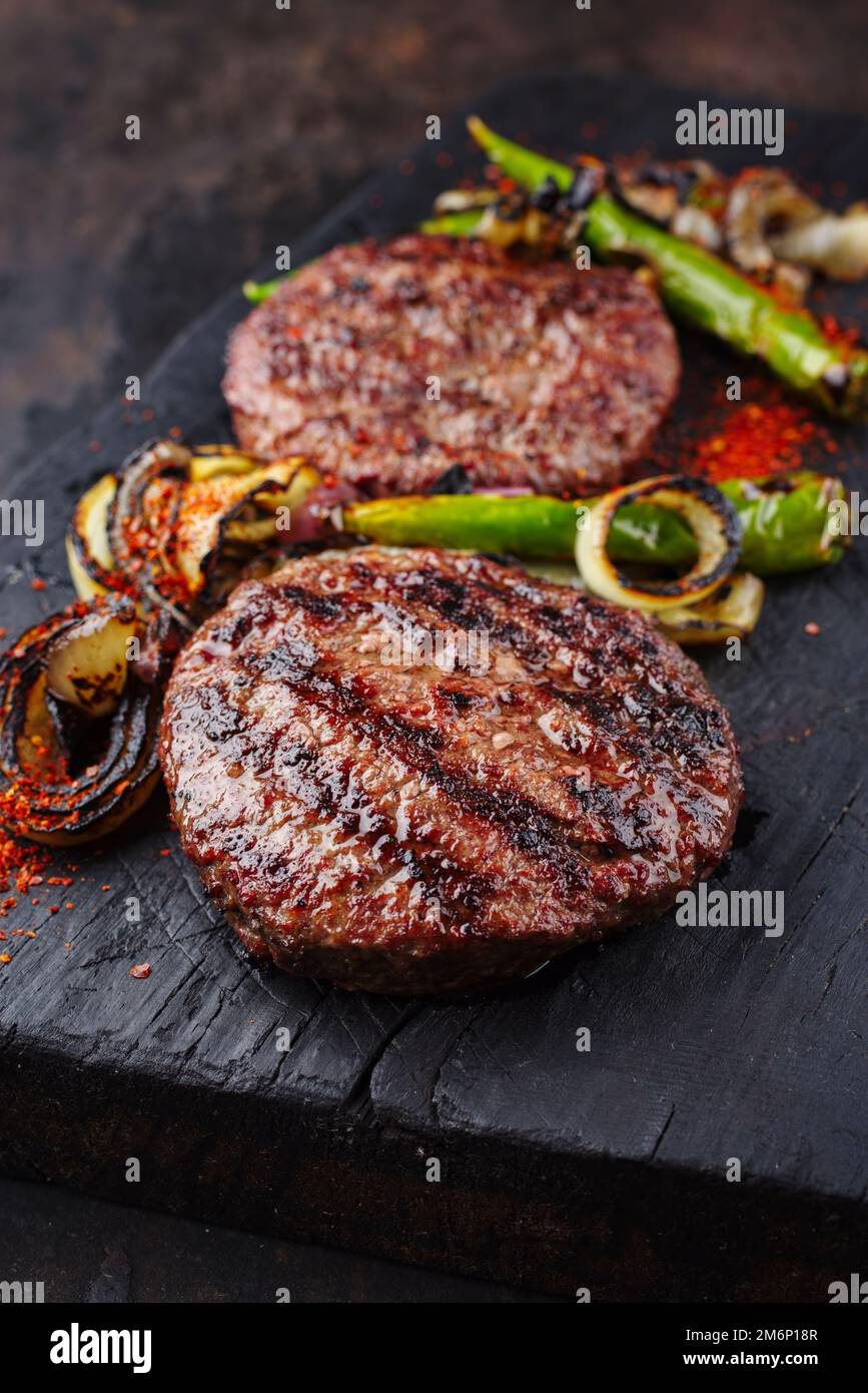 Barbecue wagyu beef Hamburger with grilled chili and onion rings served ...