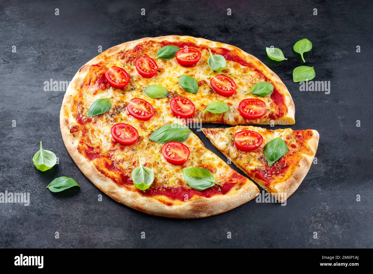 Traditional Neapolitan Italian pizza margherita with tomatoes and ...
