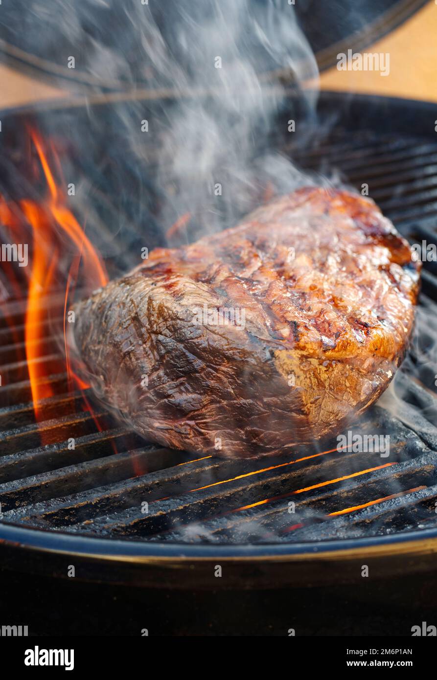 BBQ dry aged wagyu sirloin cap of rump beef steak grilled as close-up ...