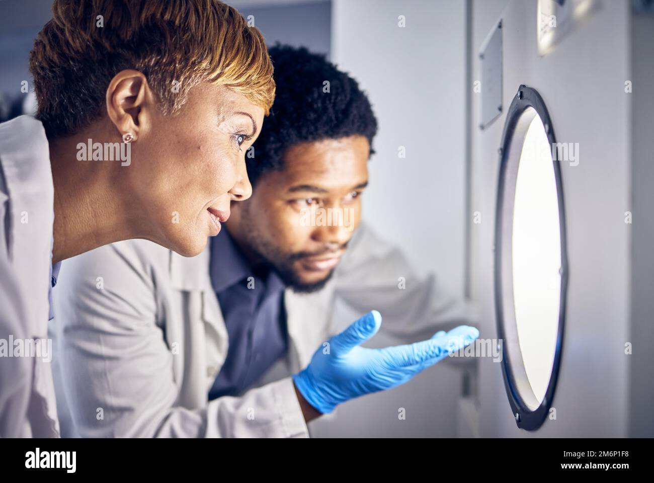 Science, man and woman in laboratory, research and test sample for cure ...