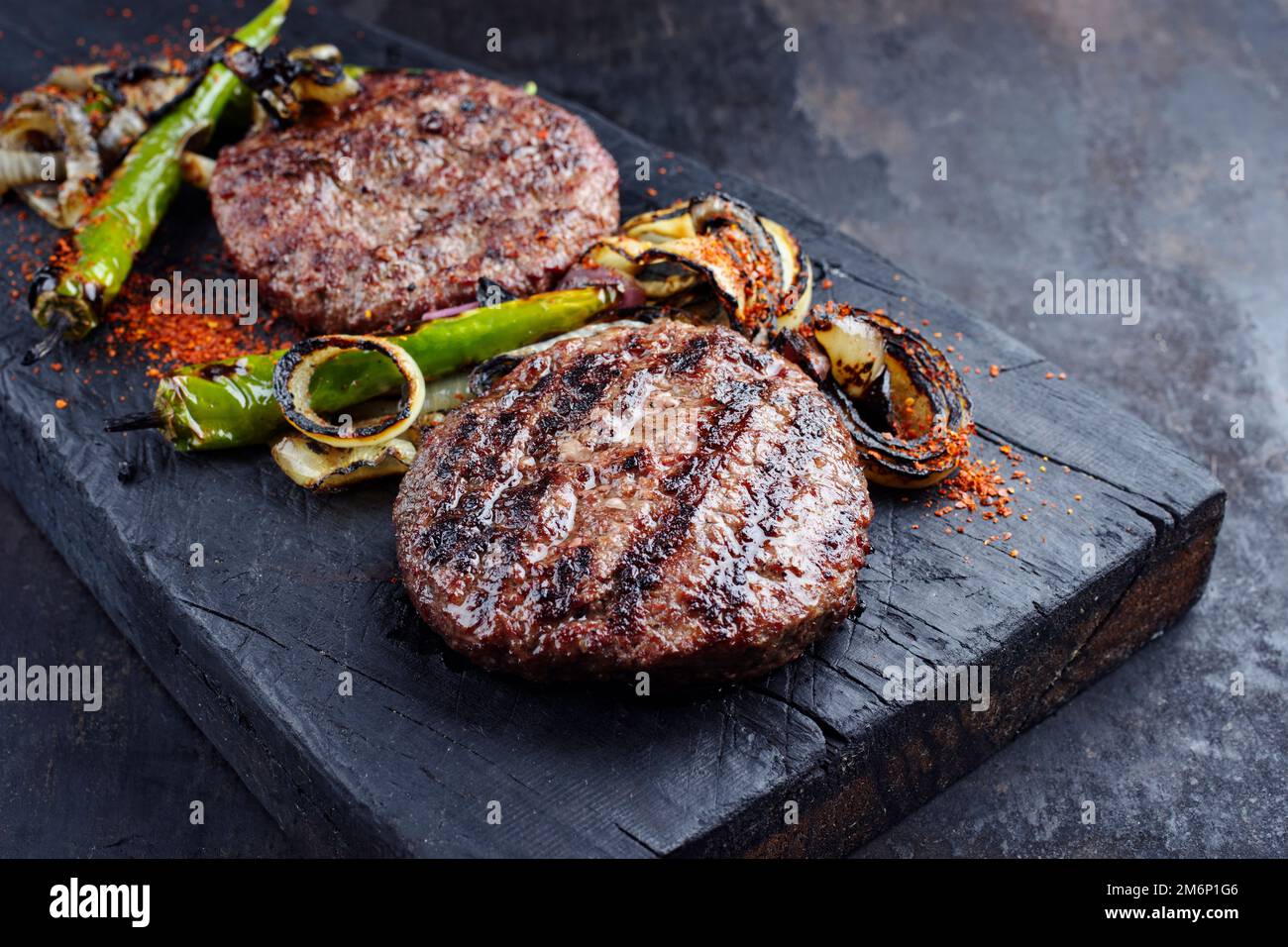 Barbecue wagyu beef Hamburger with grilled chili and onion rings served ...