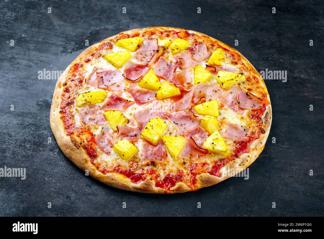 Traditional Italian pizza Hawaii with ham Stock Photo - Alamy