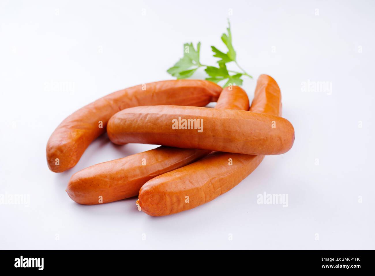 Traditional raw German bockwurst offered as top view on white ...