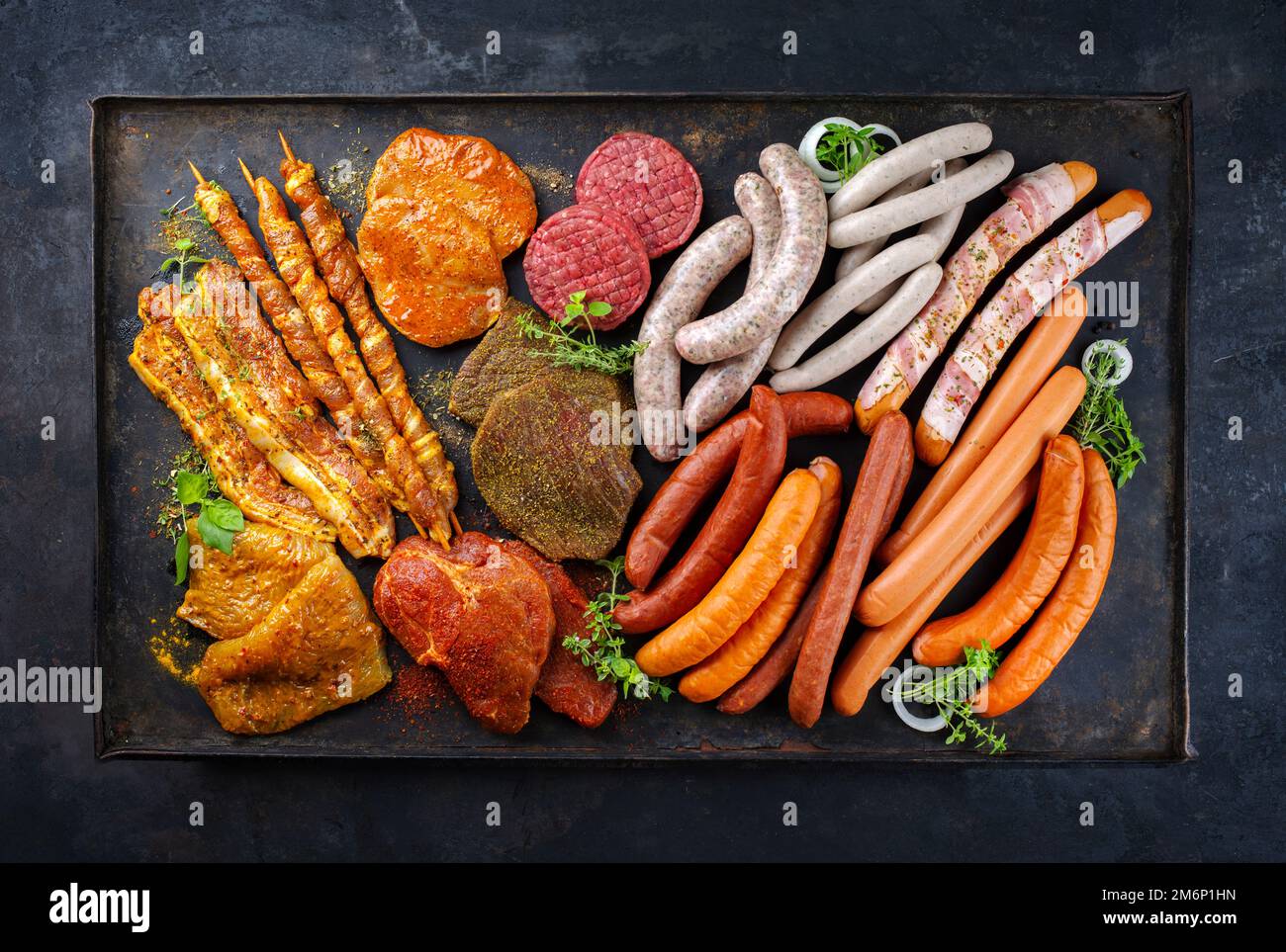 Traditional raw grill platter with bratwurst Stock Photo - Alamy