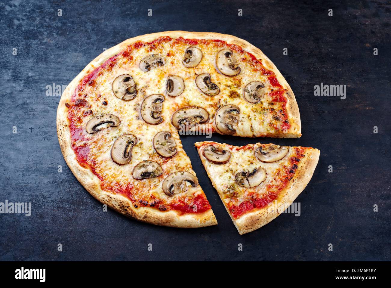 Traditional Italian pizza funghi with mushrooms and mozzarella served ...