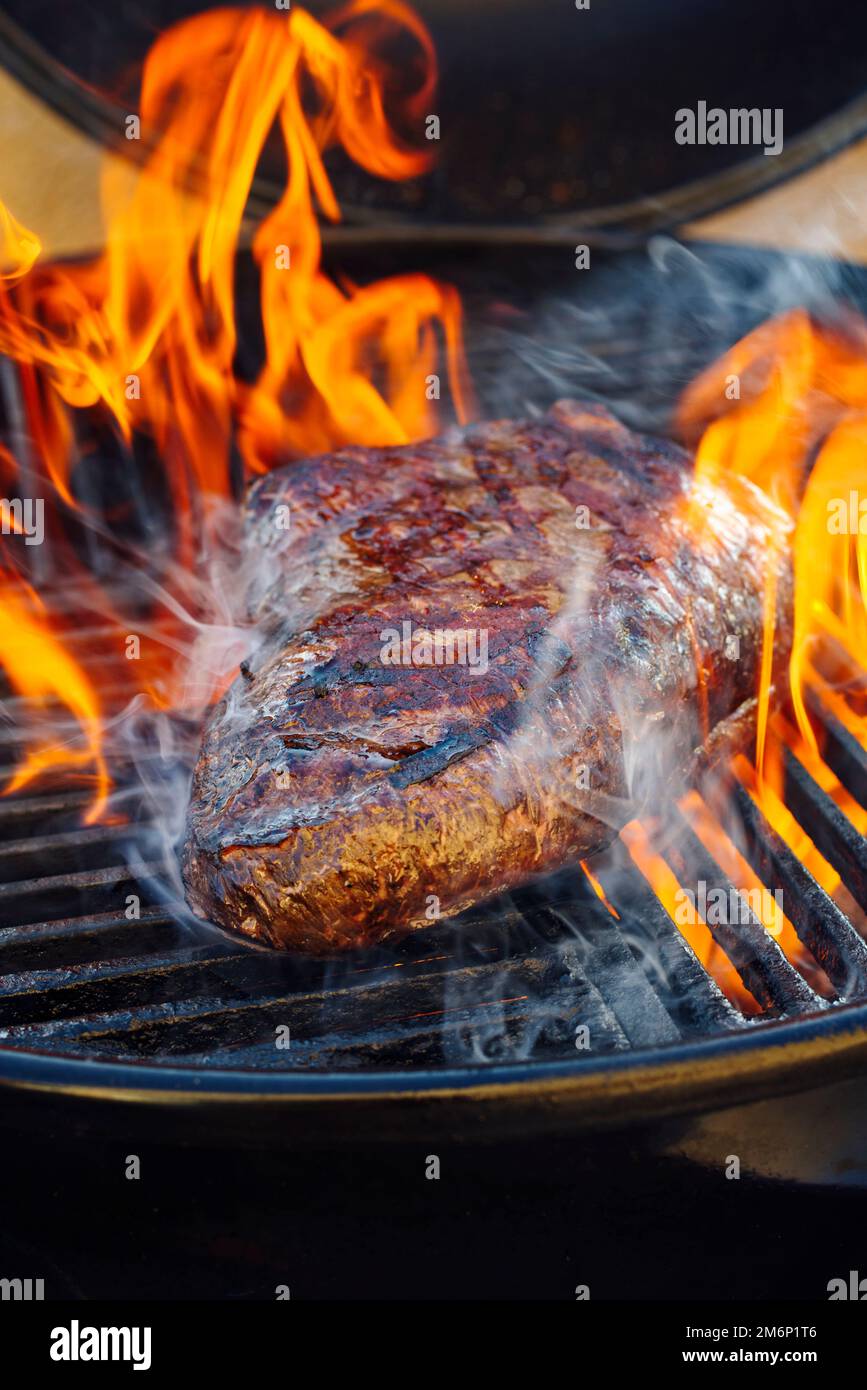 BBQ dry aged wagyu sirloin cap of rump beef steak grilled as close-up ...