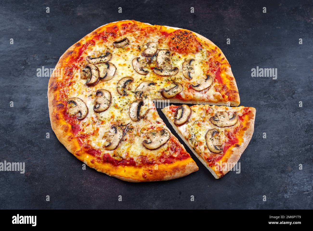 Traditional Italian pizza funghi with mushrooms and mozzarella served ...