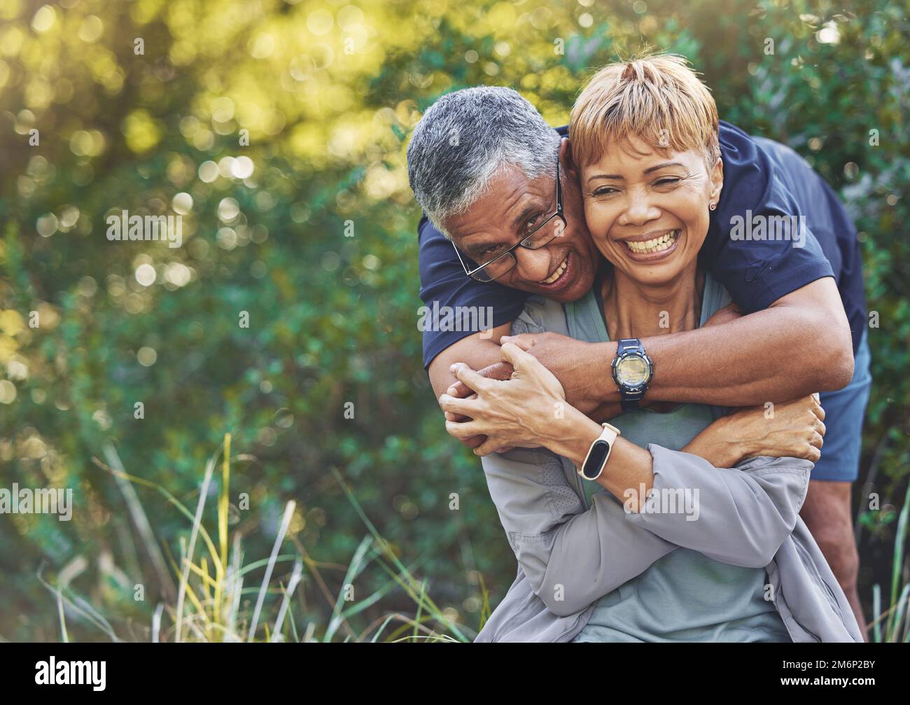 Nature, love and man hugging his wife with care, happiness and ...