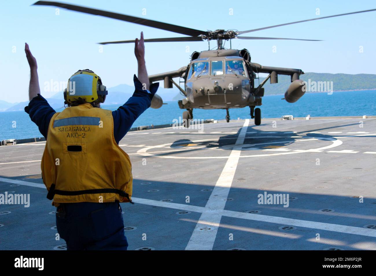 Pilots from 3-2 General Support Aviation Battalion conduct deck landing qualifications to ...