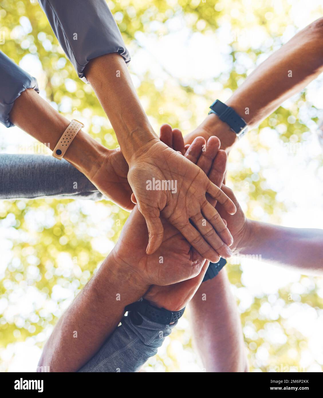 Hands, together and support with solidarity outdoor and group ...