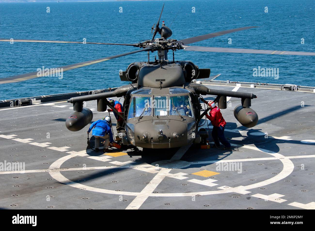 Pilots from 3-2 General Support Aviation Battalion conduct deck landing qualifications to ...