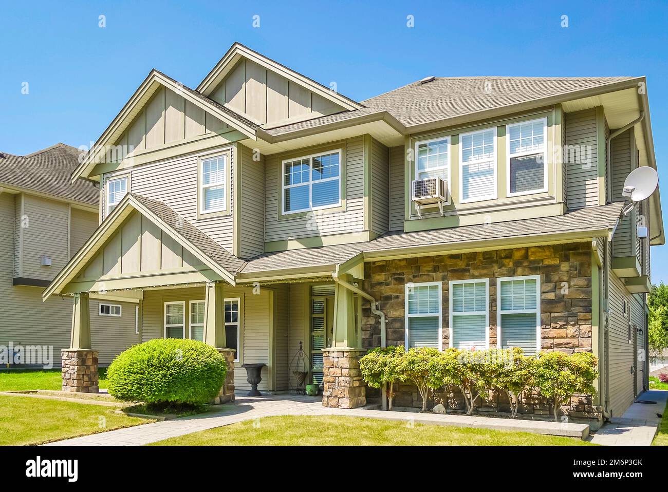 Luxury residential house with concrete pathway over front yard Stock ...